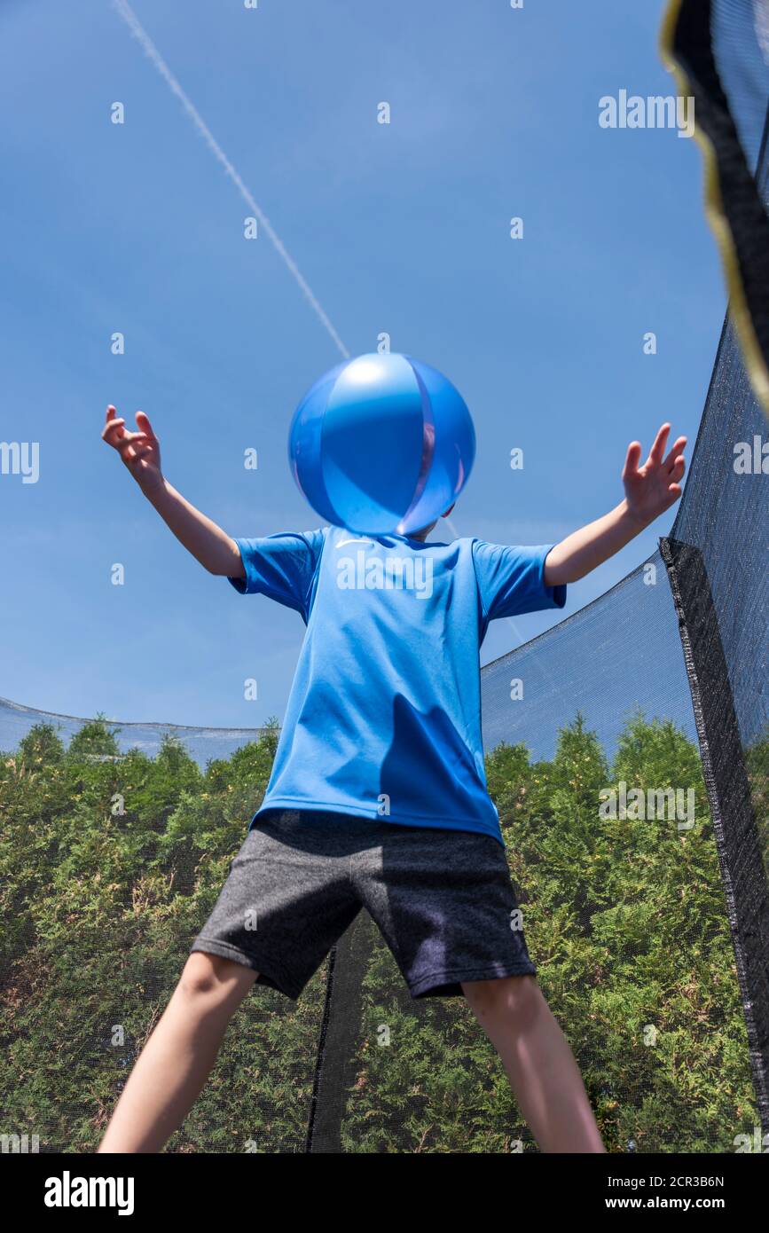 Boy bouncing ball hi-res stock photography and images - Alamy