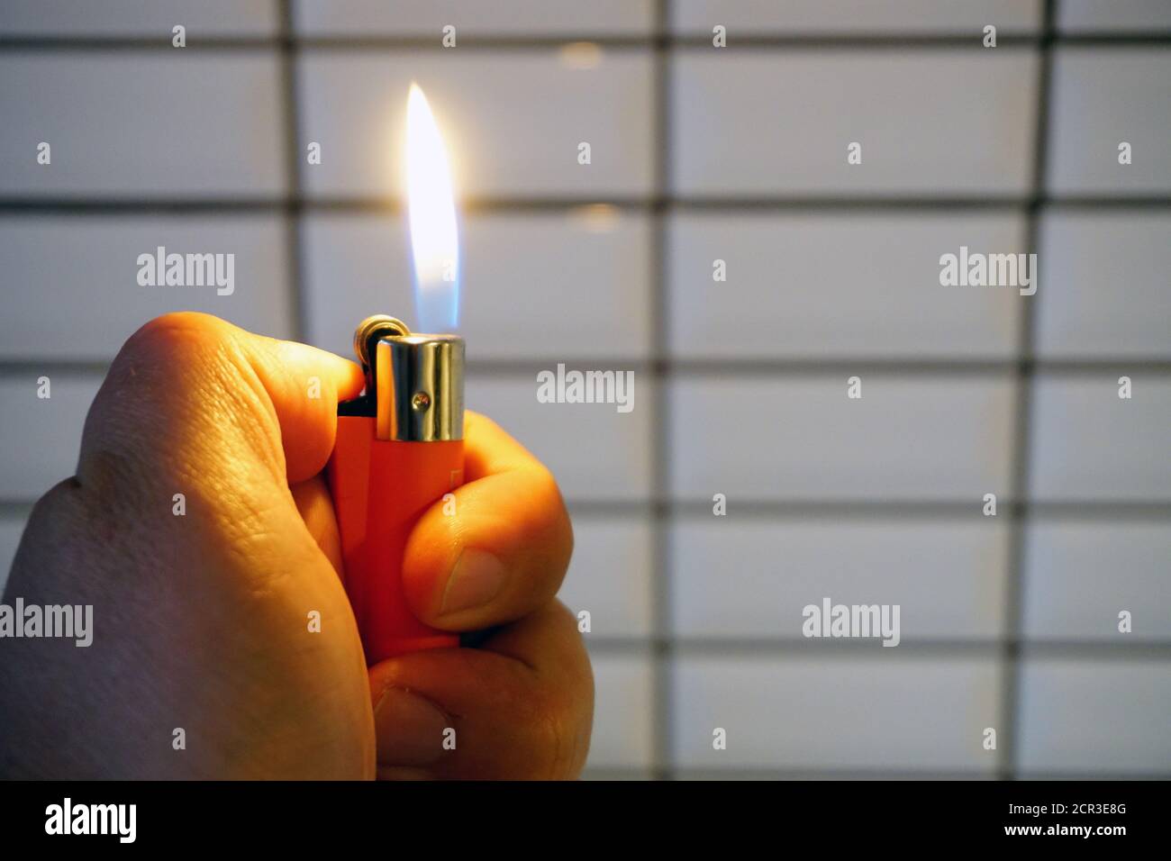 Hand holding lighter hi-res stock photography and images - Alamy