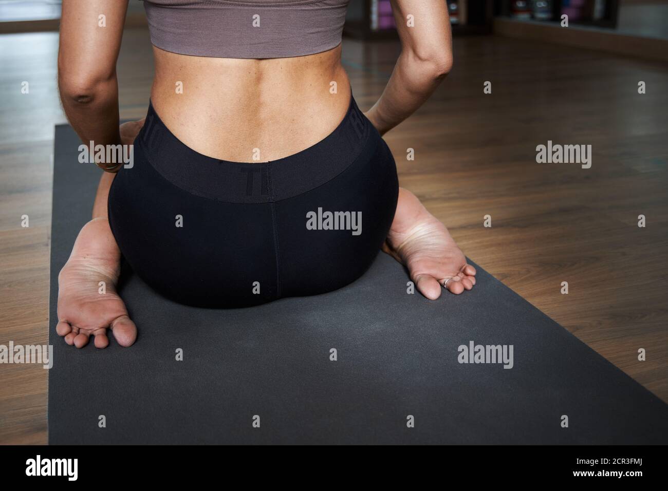 Hero pose (Virasana), iyengar yoga asana woman closeup view from the ...