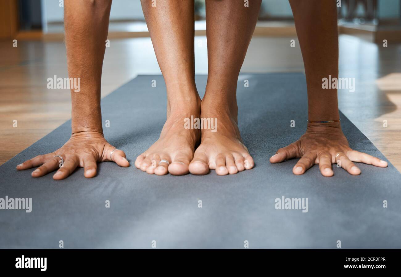 Standing Forward Bend pose in yoga iyengar, Uttanasana fold pose close ...