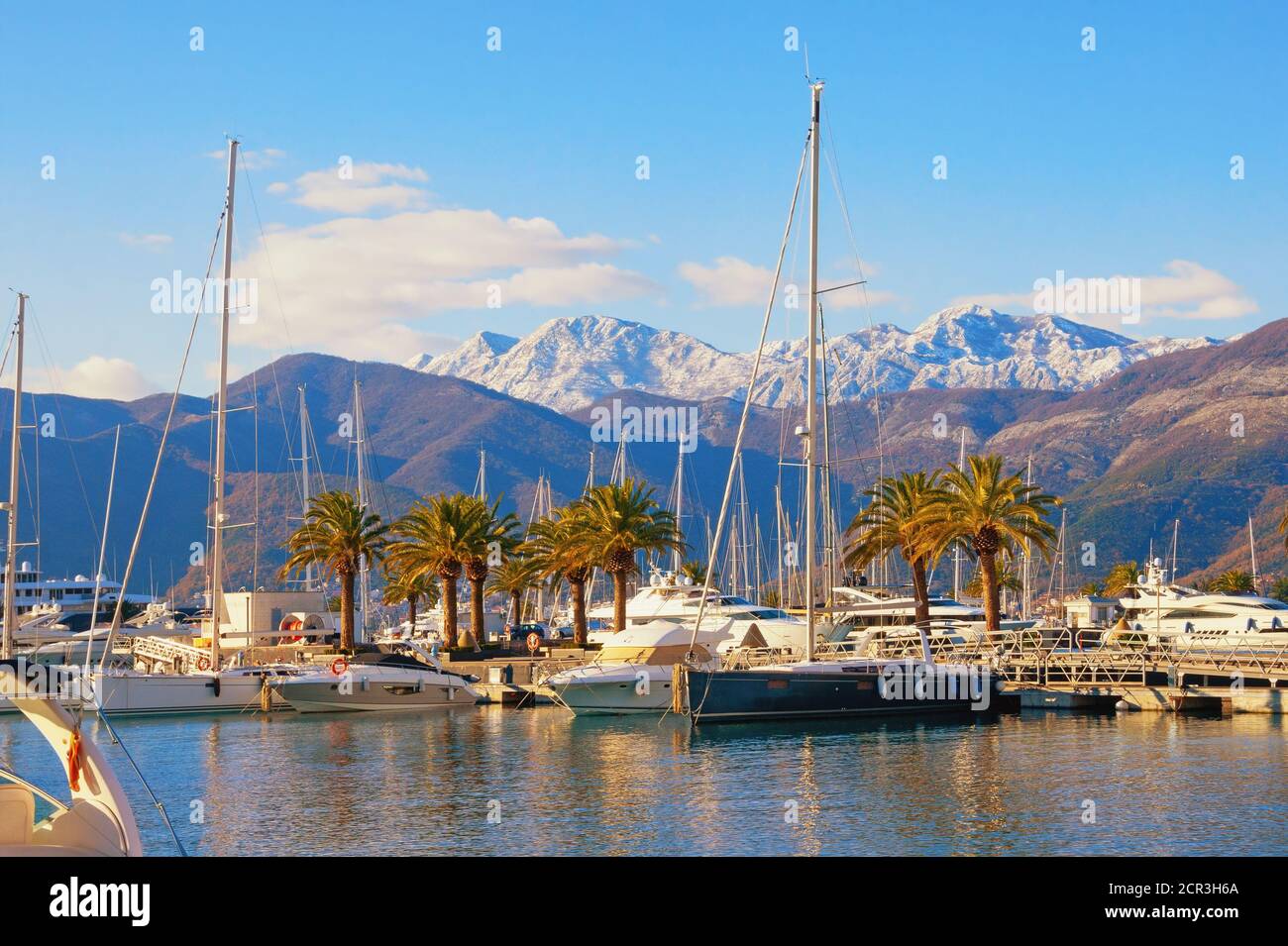 Beautiful winter Mediterranean landscape. Yacht marina at foot of snow ...