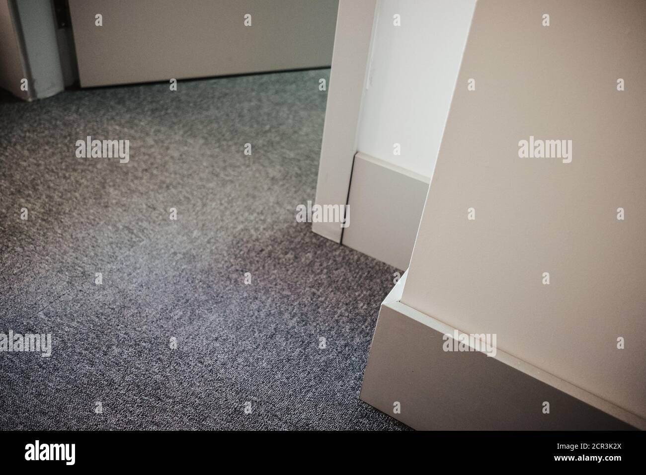 Tilted shot of the floor and an open door Stock Photo - Alamy