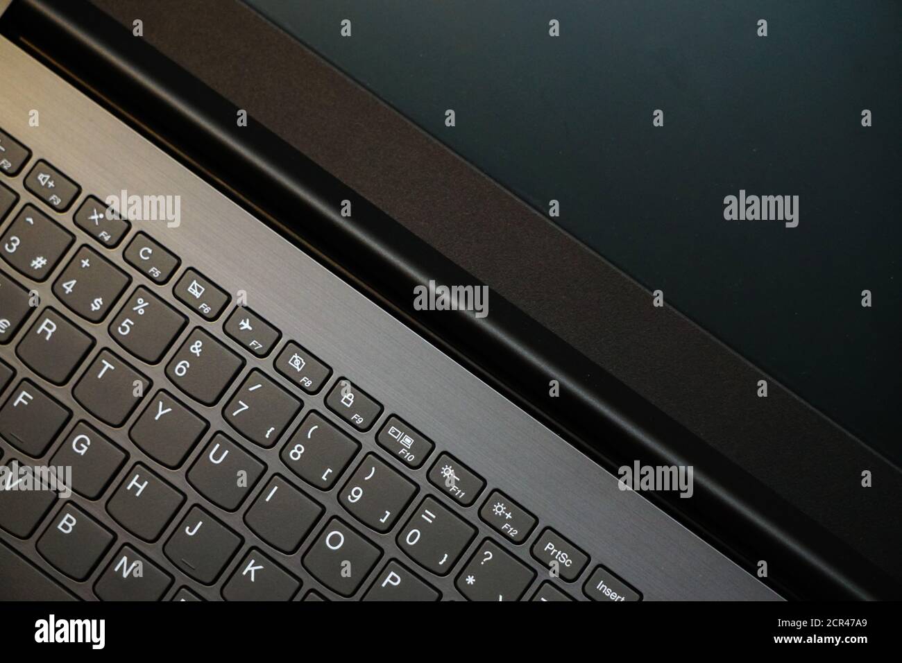 Laptop monitor and keyboard in triangle orientation asymmetric image ...