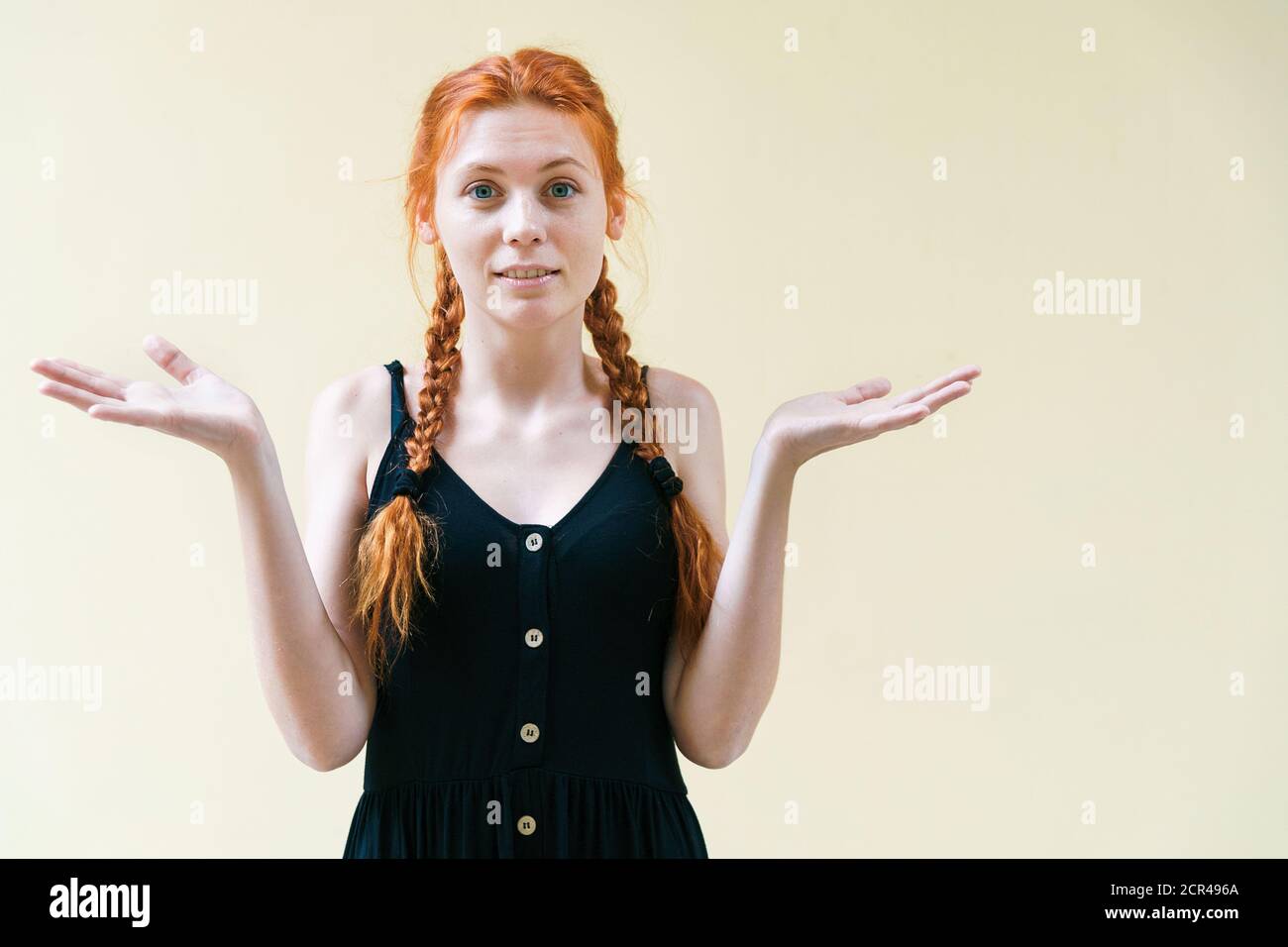 Beautiful restless girl posing on yellow background. Turmoil and fuss ...
