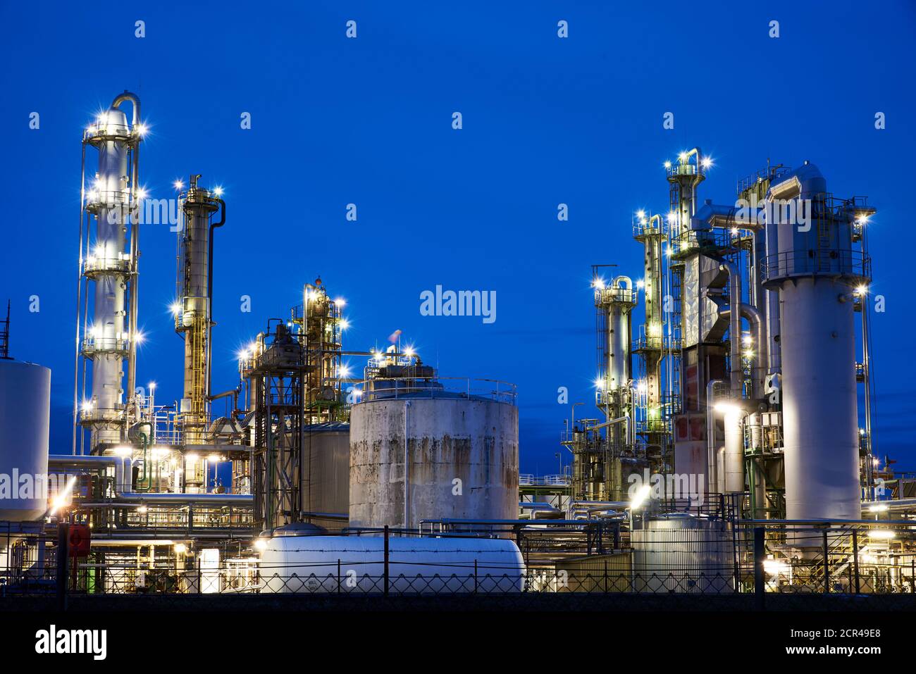 Petroleum refinery after sunset with lights Stock Photo - Alamy