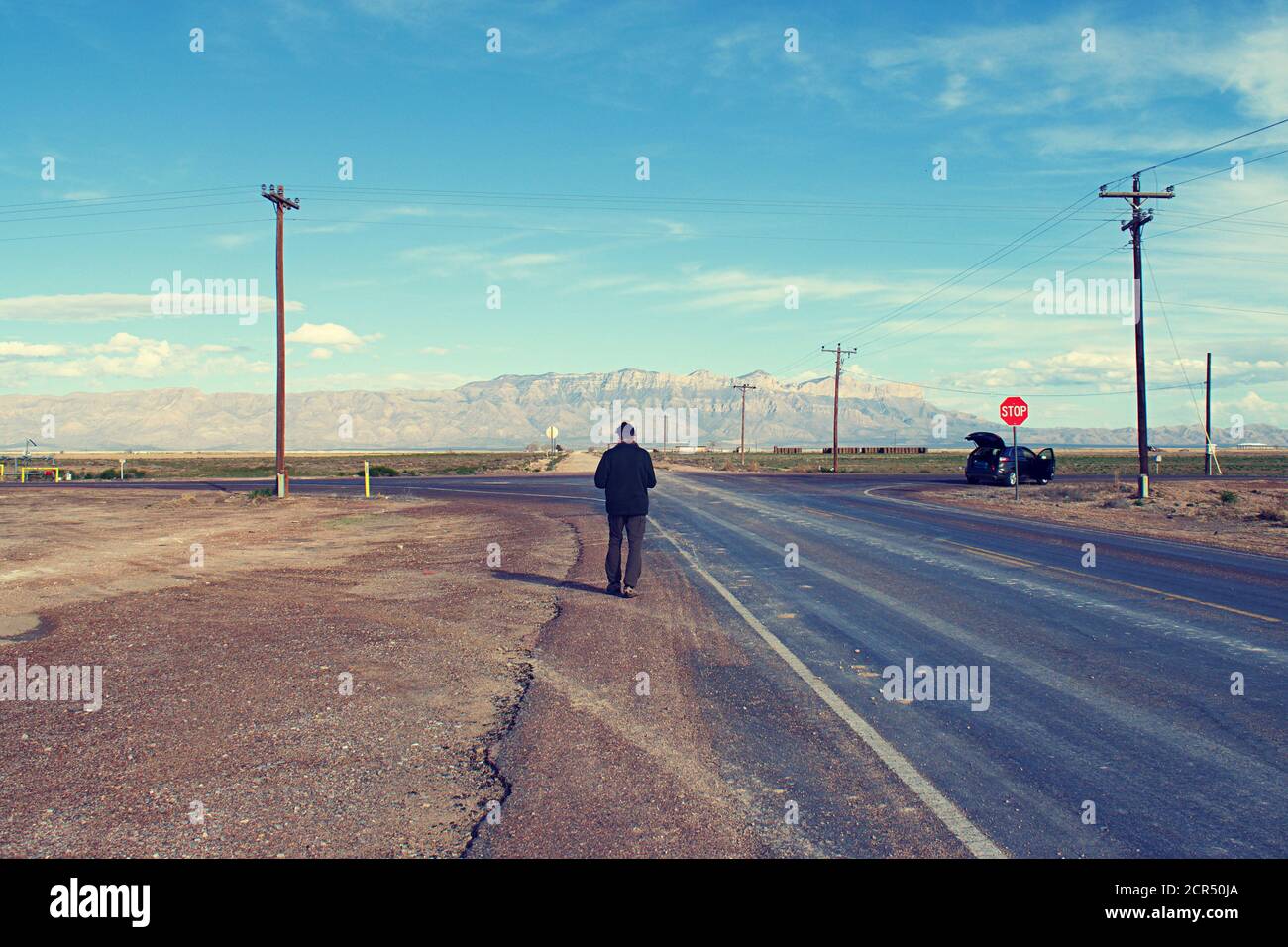 Man walking along highway hi-res stock photography and images - Alamy