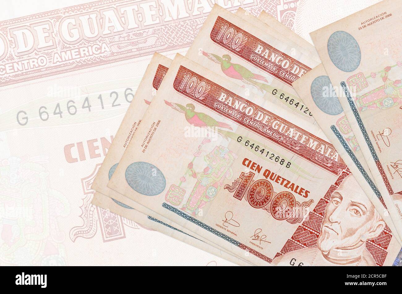 100 Guatemalan quetzales bills lies in stack on background of big semi ...