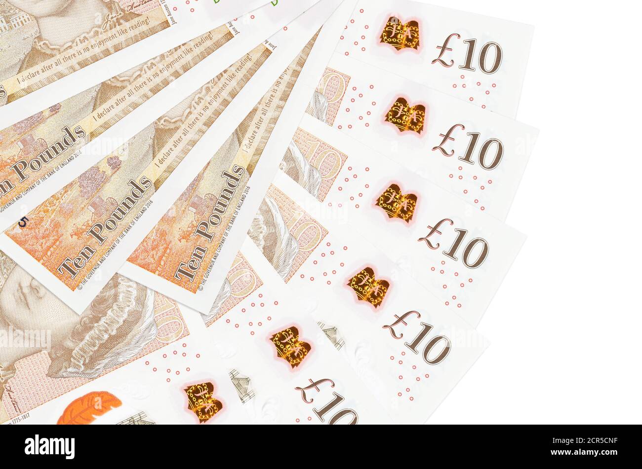 10 British pounds bills lies isolated on white background with copy ...