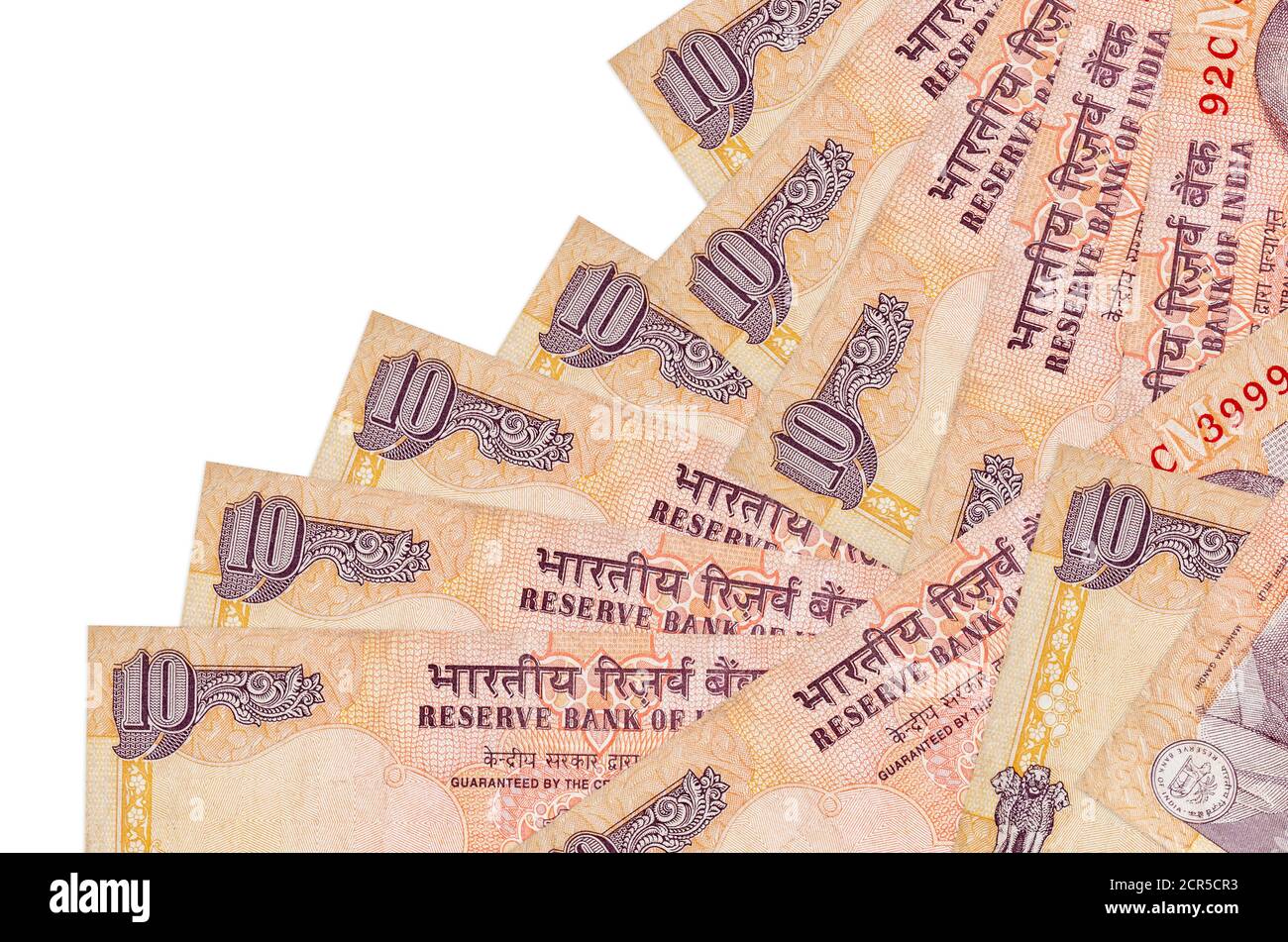 10 Indian rupees bills lies in different order isolated on white. Local ...