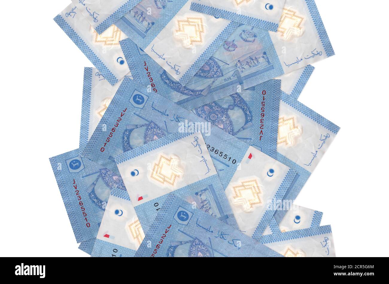 1 Malaysian ringgit bills flying down isolated on white. Many banknotes ...