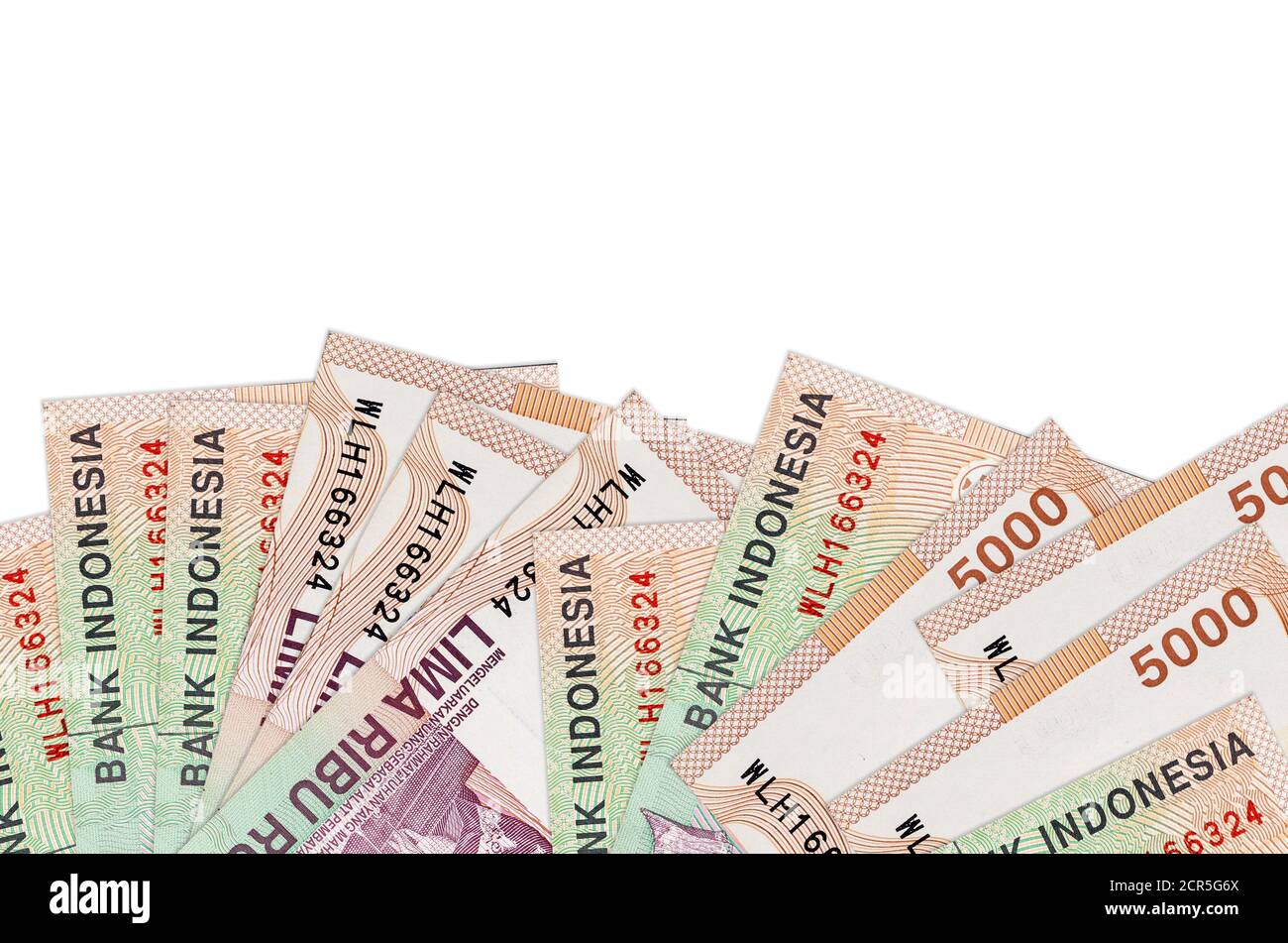 5000 Indonesian rupiah bills lies on bottom side of screen isolated on ...