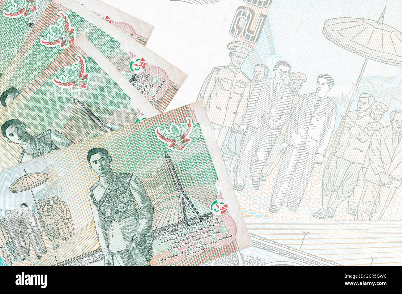 20 Thai Baht bills lies in stack on background of big semi-transparent ...