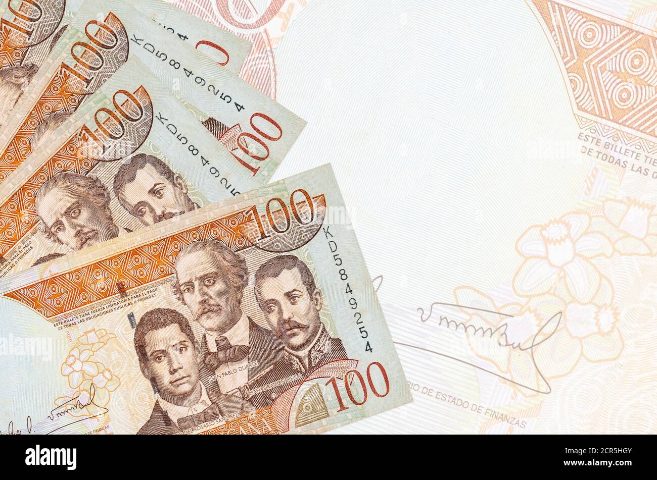 100 Dominican peso bills lies in stack on background of big semi ...