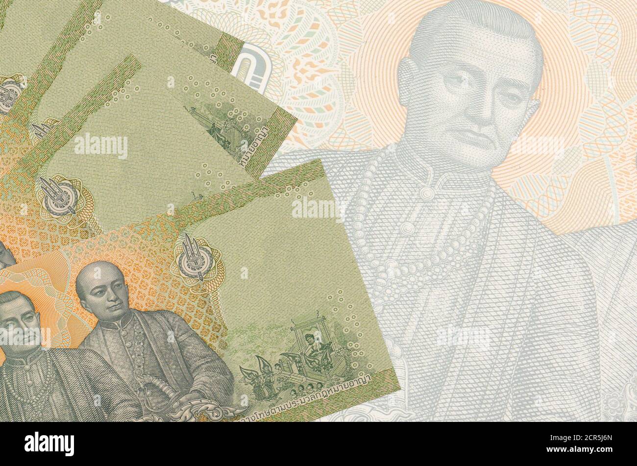 20 Thai Baht bills lies in stack on background of big semi-transparent ...