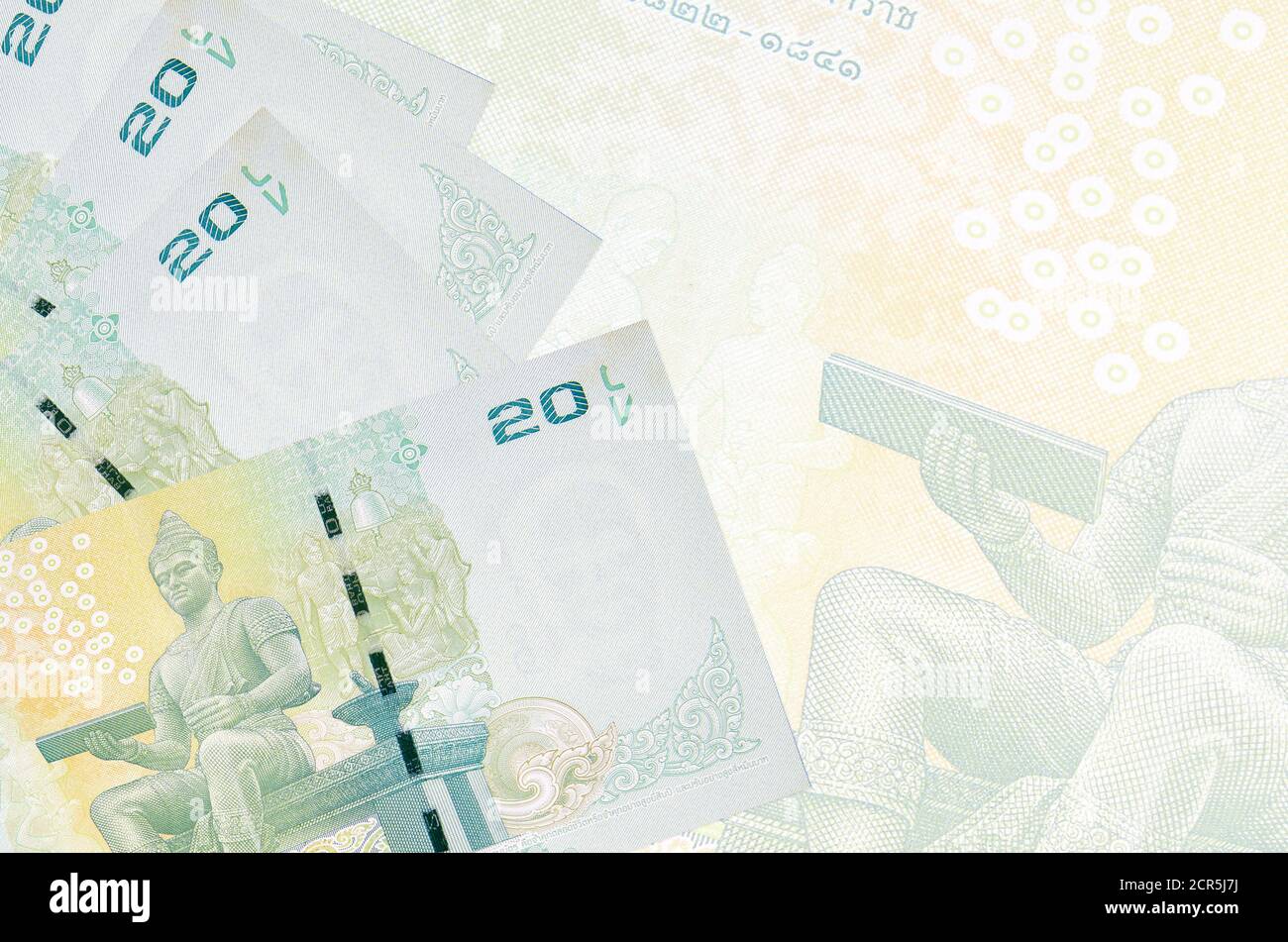20 Thai Baht bills lies in stack on background of big semi-transparent ...