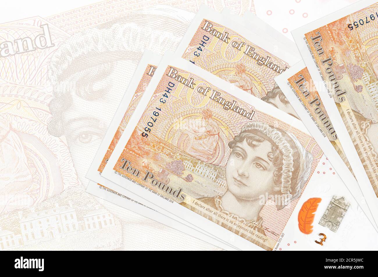 10 British pounds bills lies in stack on background of big semi ...