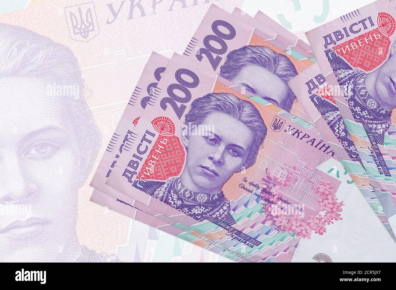 200 Ukrainian hryvnias bills lies in stack on background of big semi ...