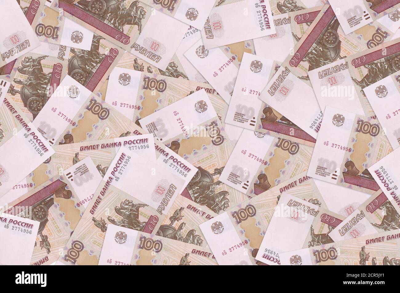 100 russian rubles bills lies in big pile. Rich life conceptual ...