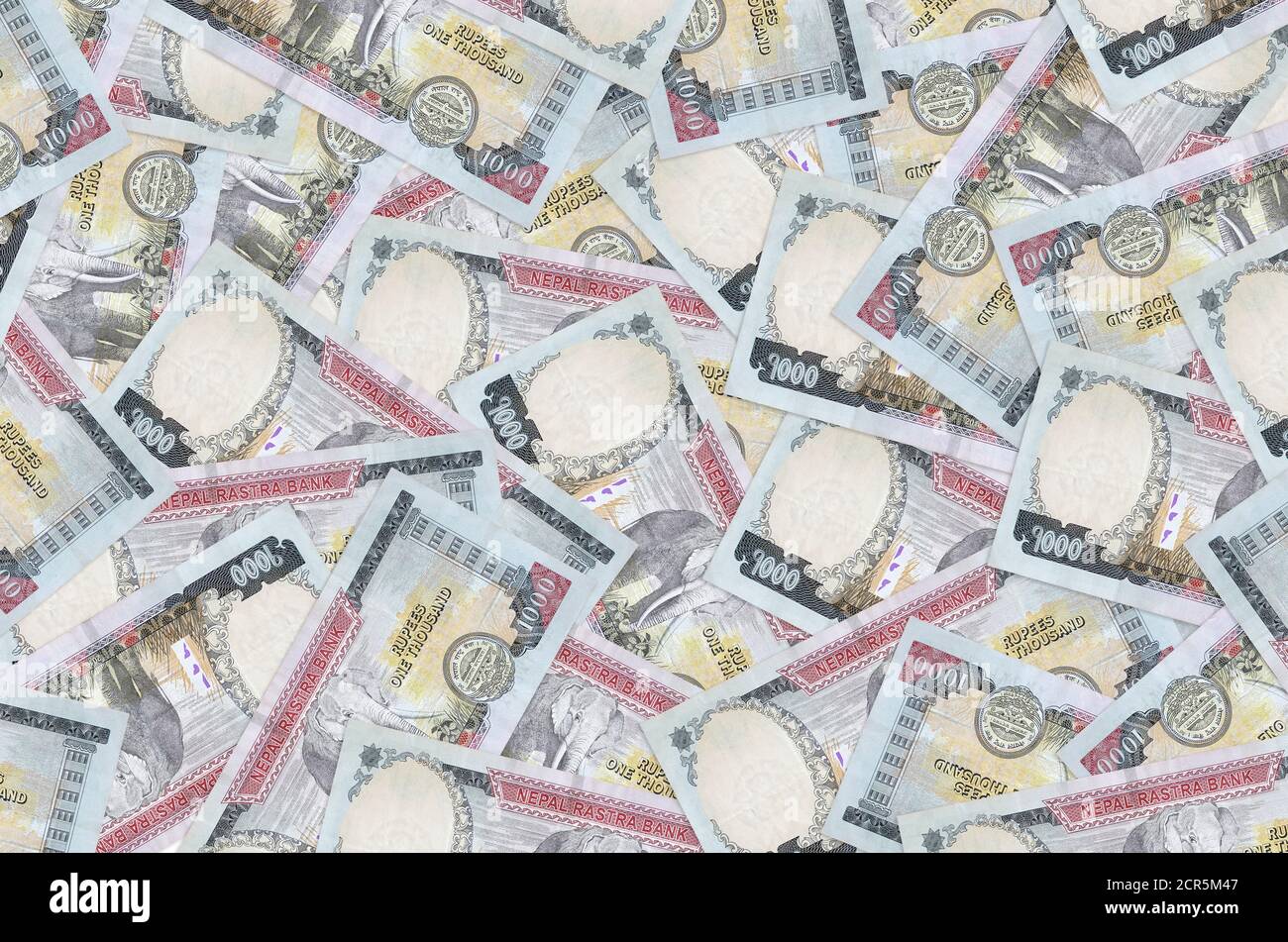 1000 Nepalese rupees bills lies in big pile. Rich life conceptual ...