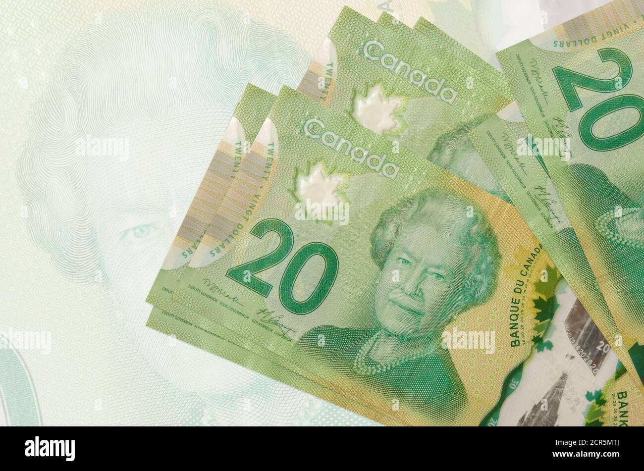 20 Canadian dollars bills lies in stack on background of big semi ...