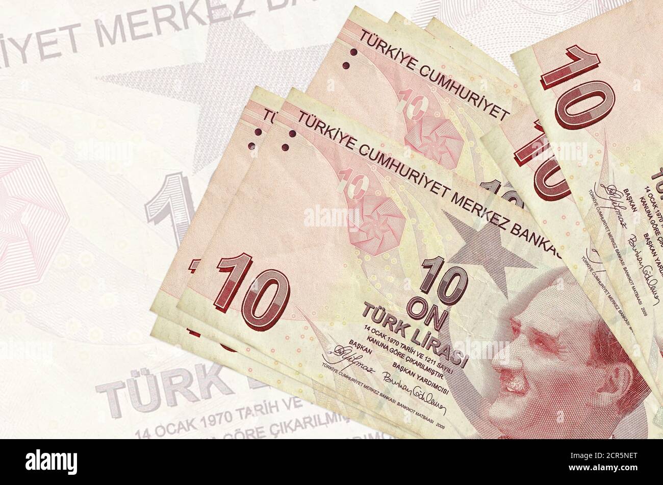 10 Turkish liras bills lies in stack on background of big semi ...