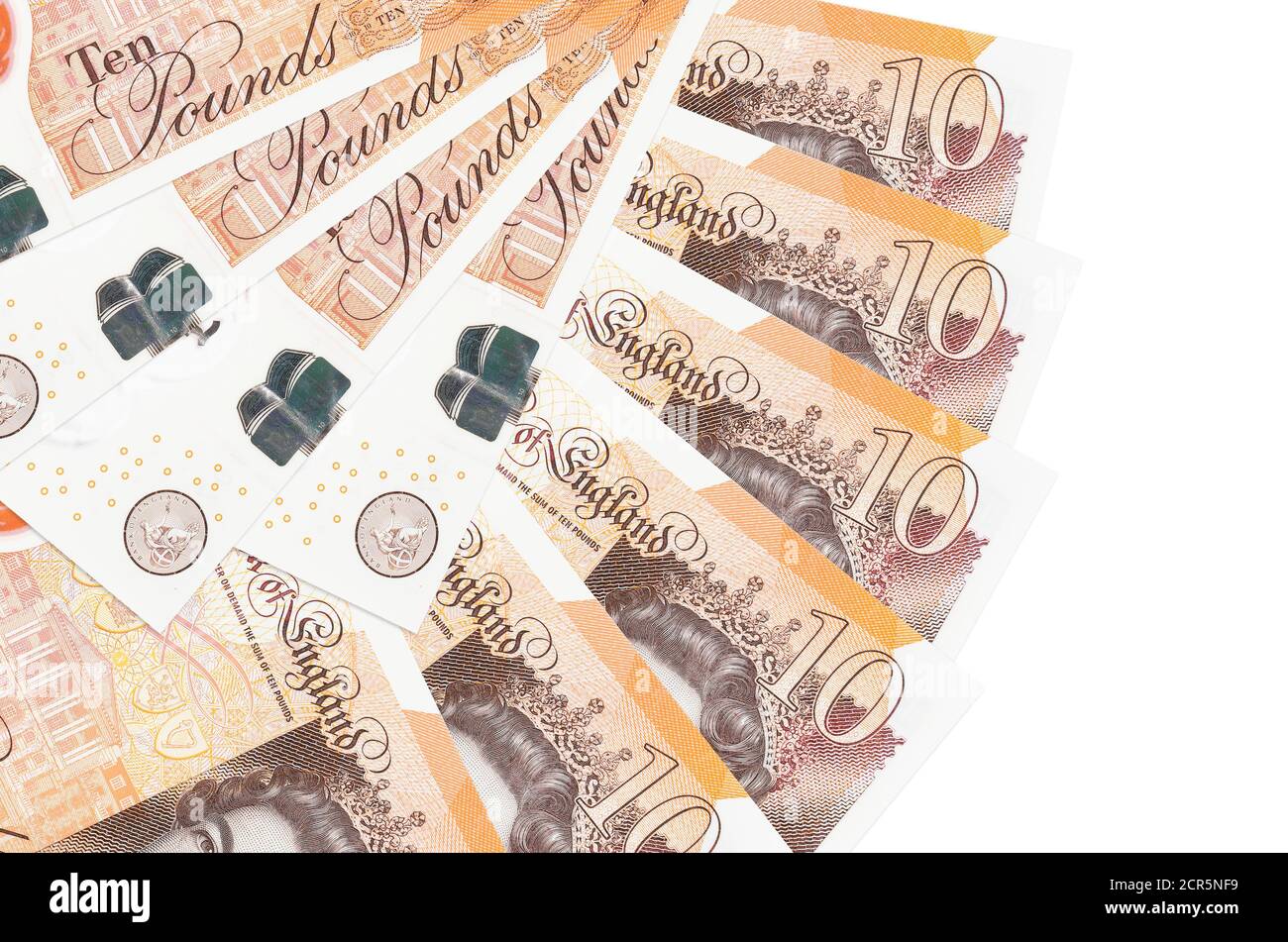10 British pounds bills lies isolated on white background with copy ...