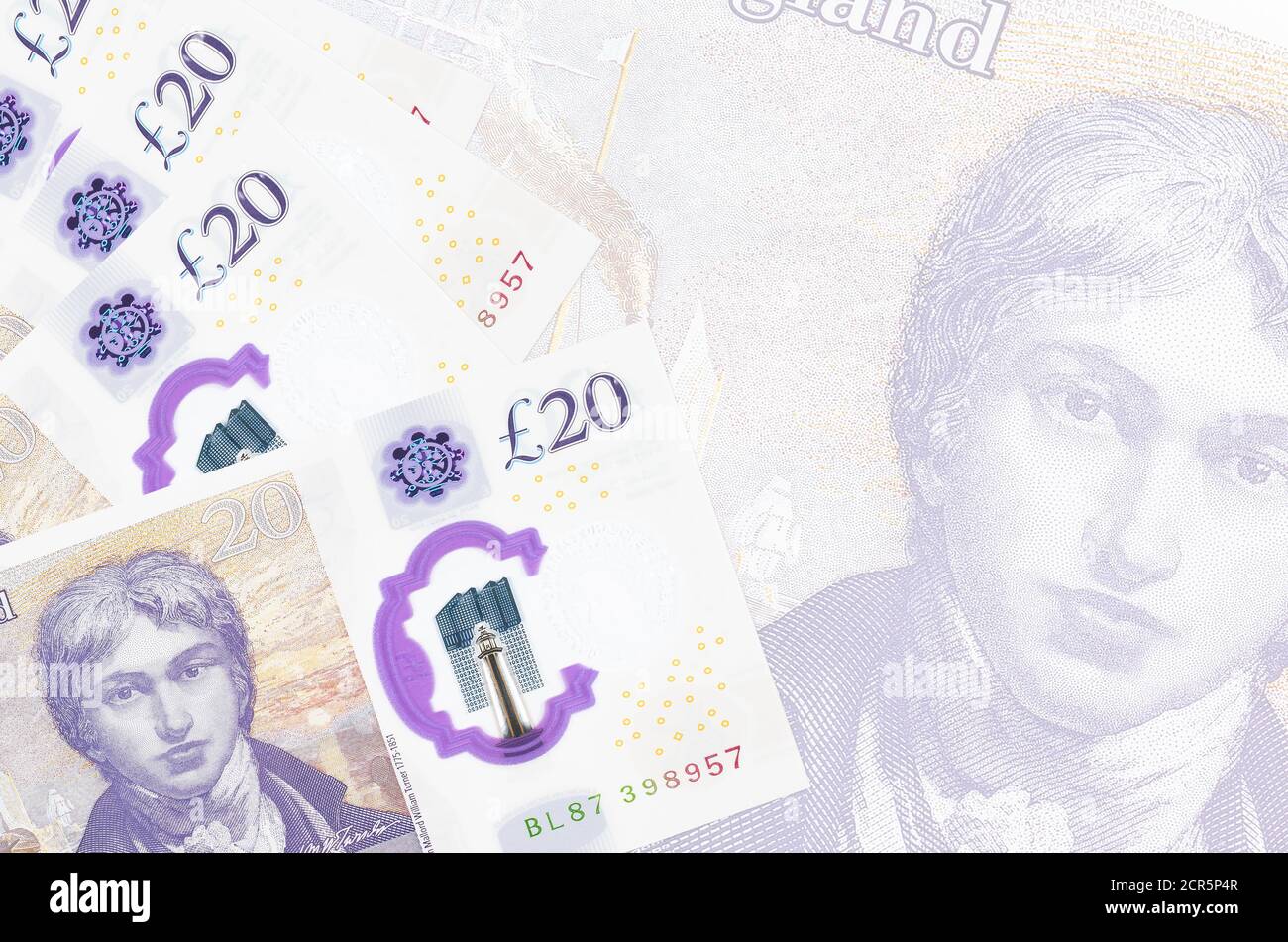 20 British pounds bills lies in stack on background of big semi ...