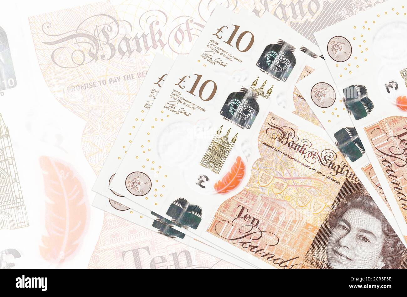 10 British pounds bills lies in stack on background of big semi ...