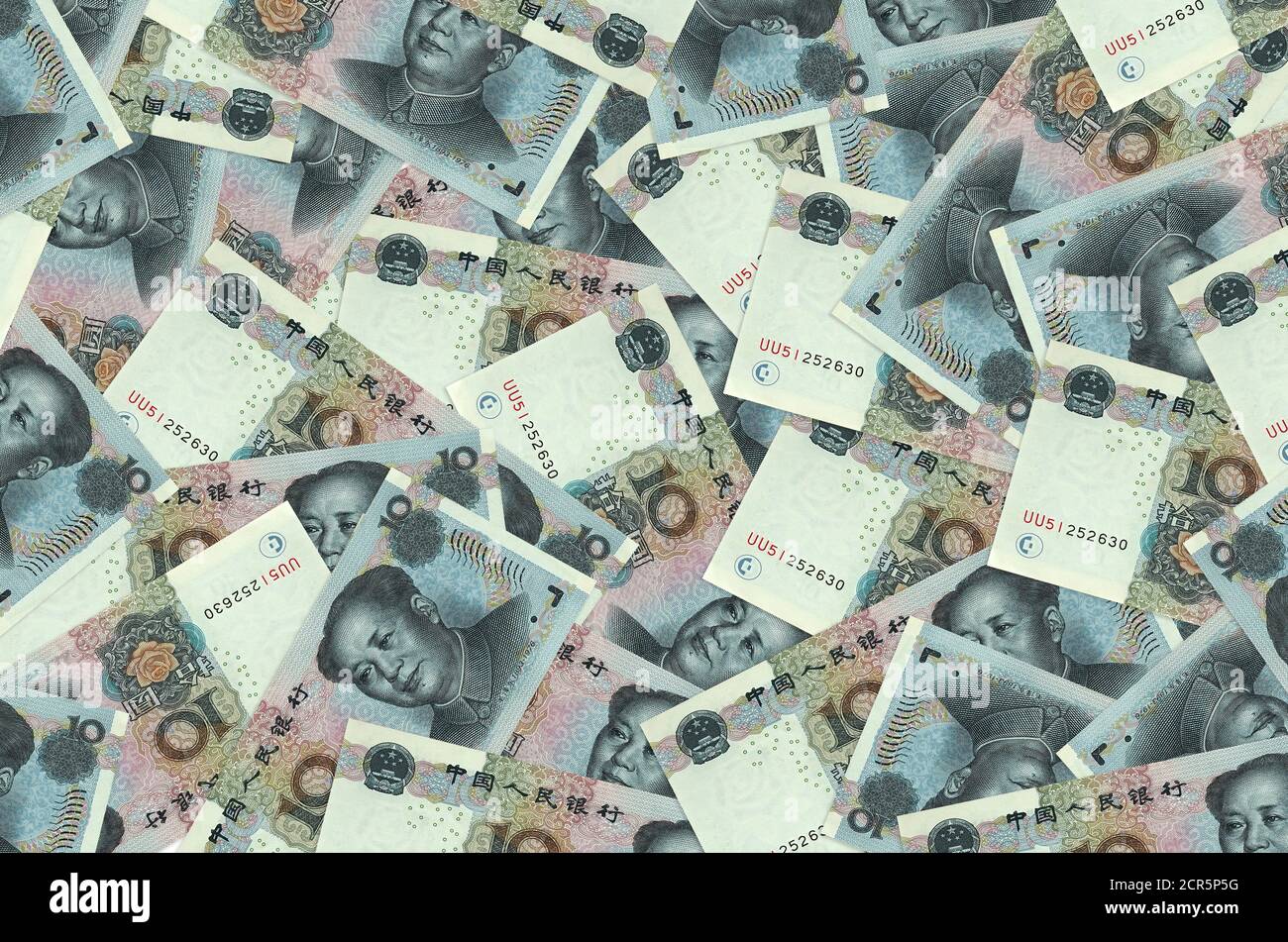 10 Chinese yuan bills lies in big pile. Rich life conceptual background ...