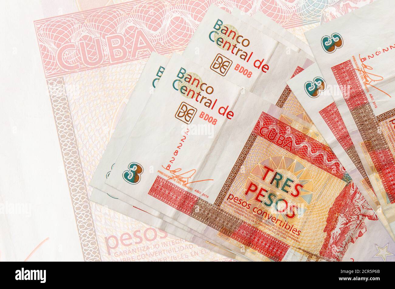 3 cuban pesos convertibles bills lies in stack on background of big ...