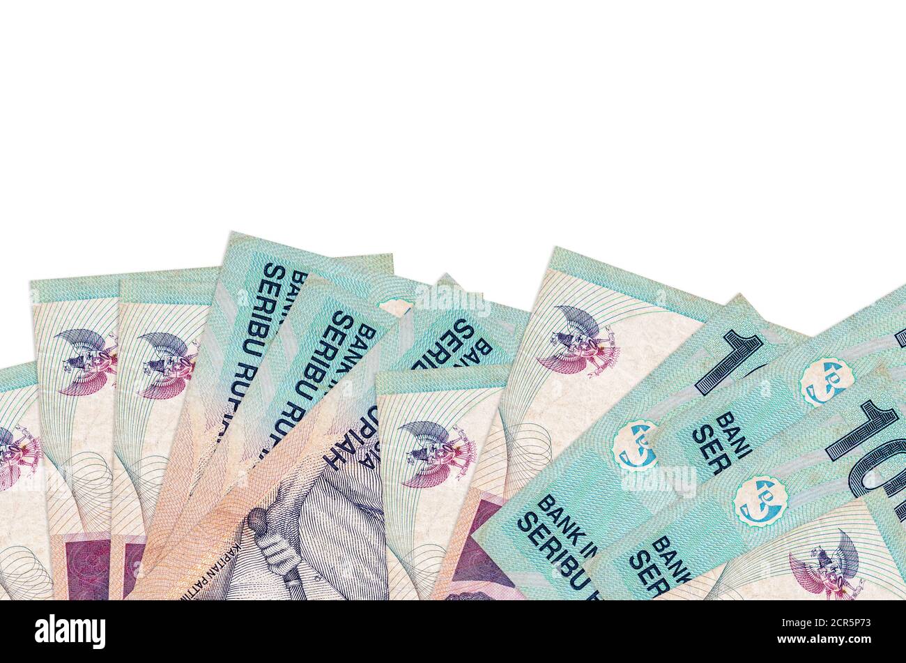 1000 Indonesian rupiah bills lies on bottom side of screen isolated on ...