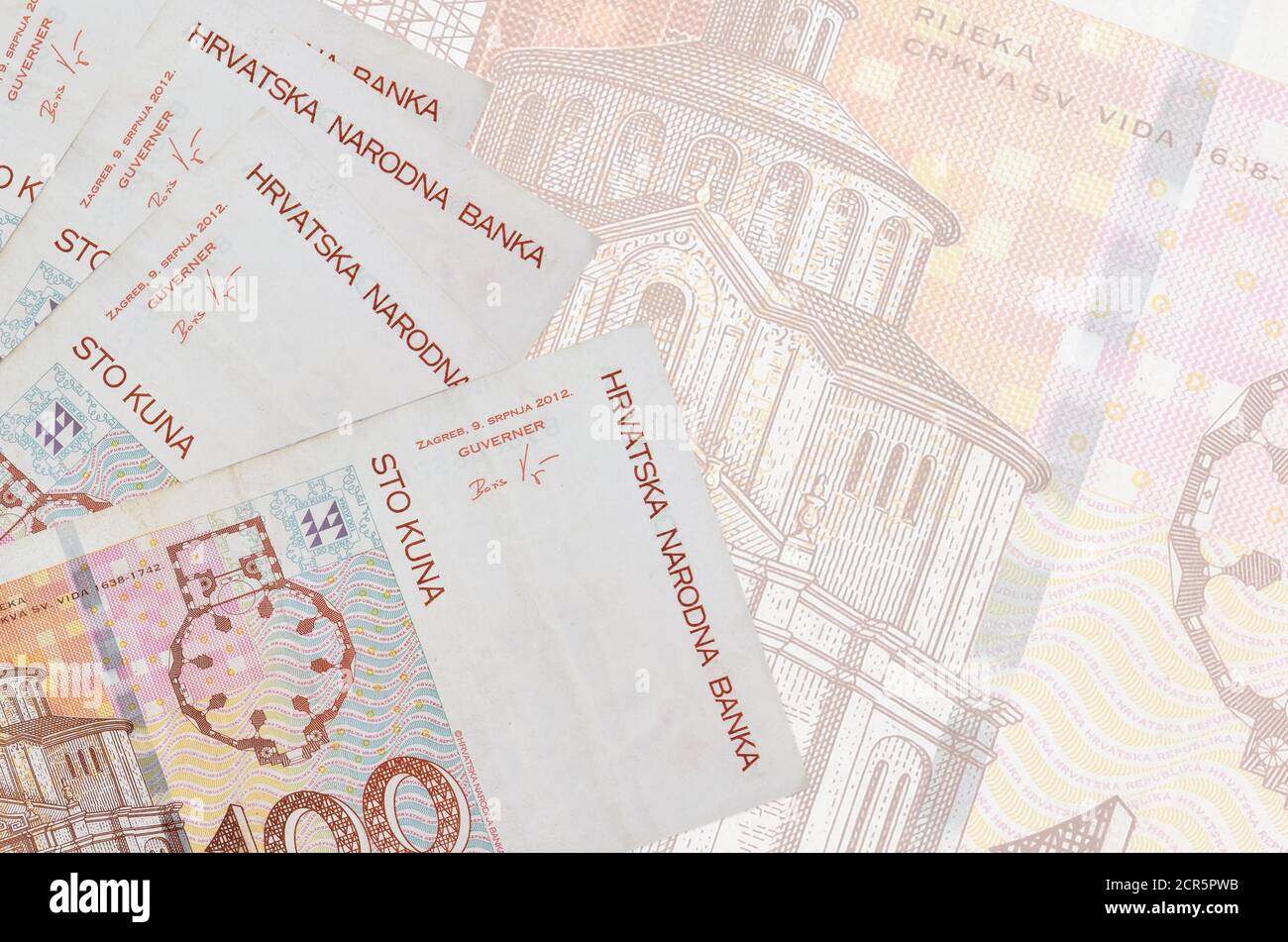 100 Croatian kuna bills lies in stack on background of big semi ...