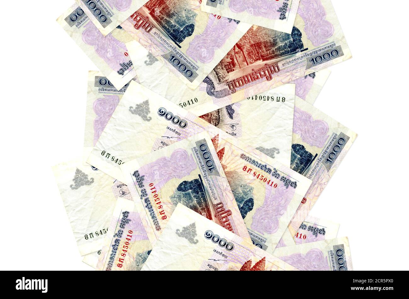 1000 Cambodian riels bills flying down isolated on white. Many ...