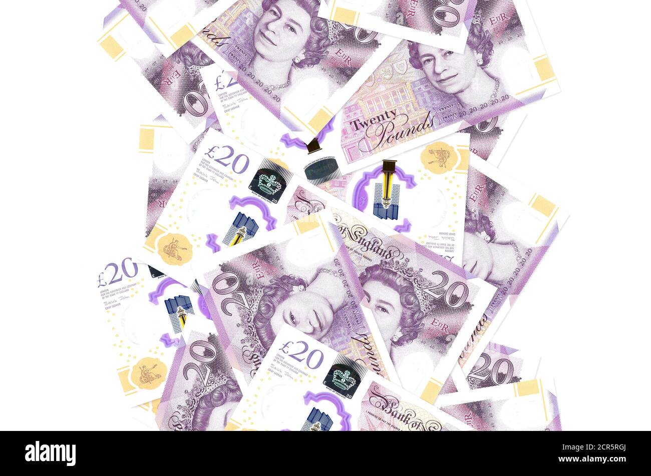 20 British pounds bills flying down isolated on white. Many banknotes ...