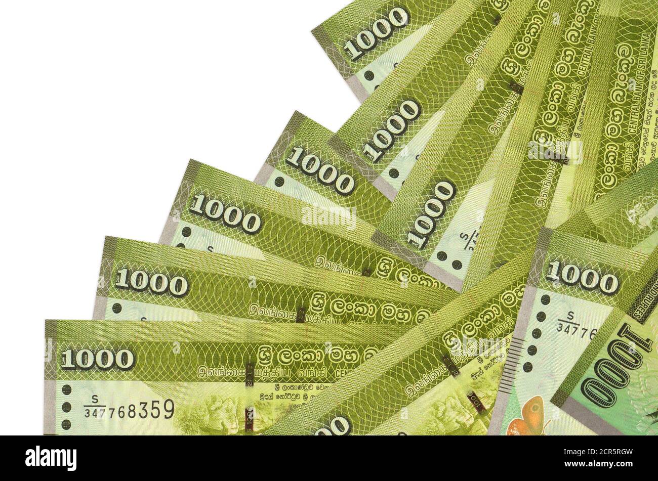 1000 Sri Lankan rupees bills lies in different order isolated on white ...