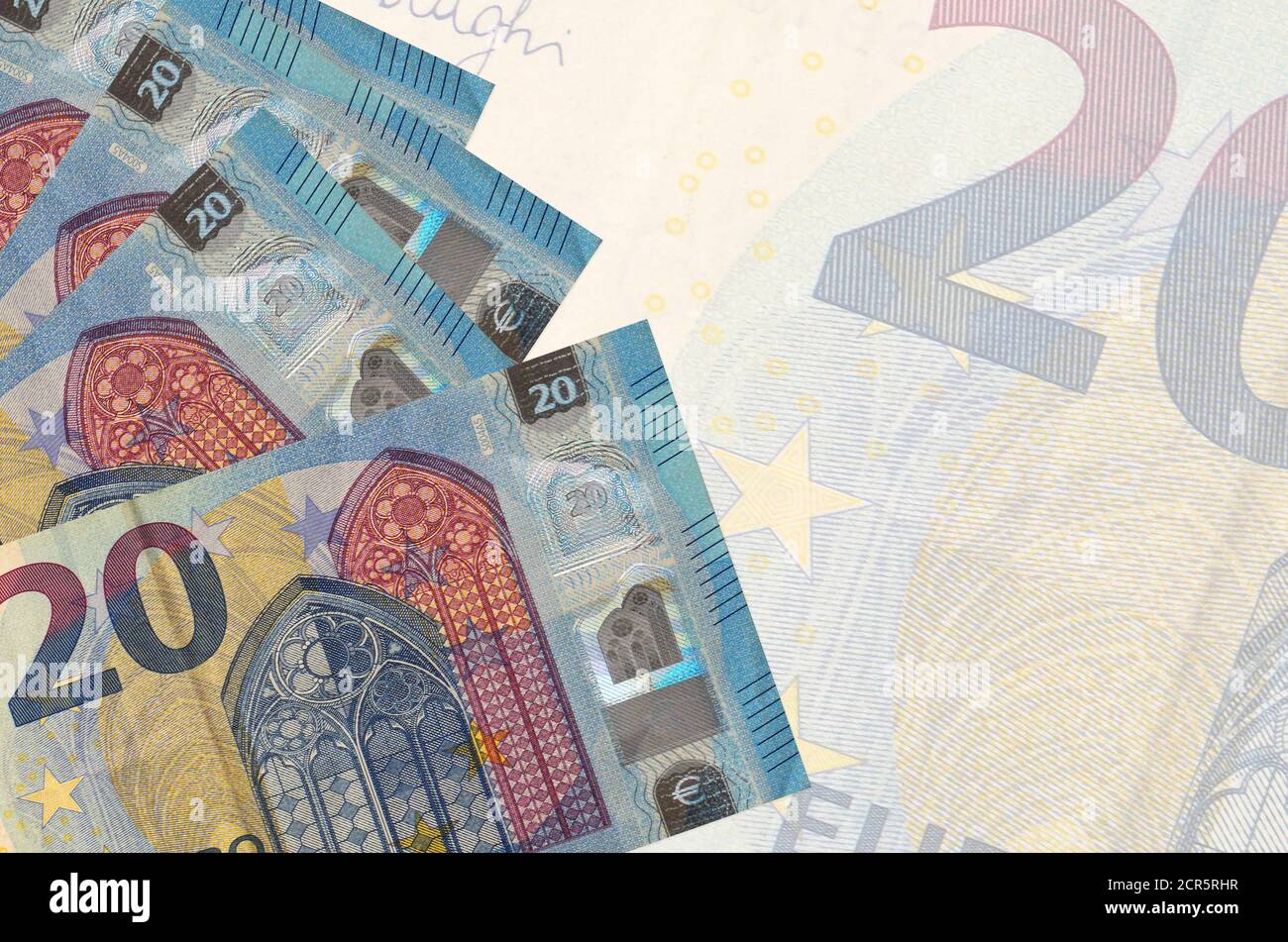 20 euro bills lies in stack on background of big semi-transparent ...