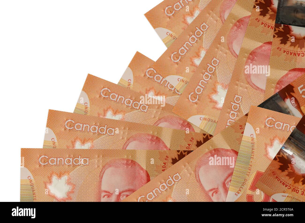 50 Canadian Dollars Bills Lies In Different Order Isolated On White 50-canadian-dollars-bills-lies-in-different-order-isolated-on-white