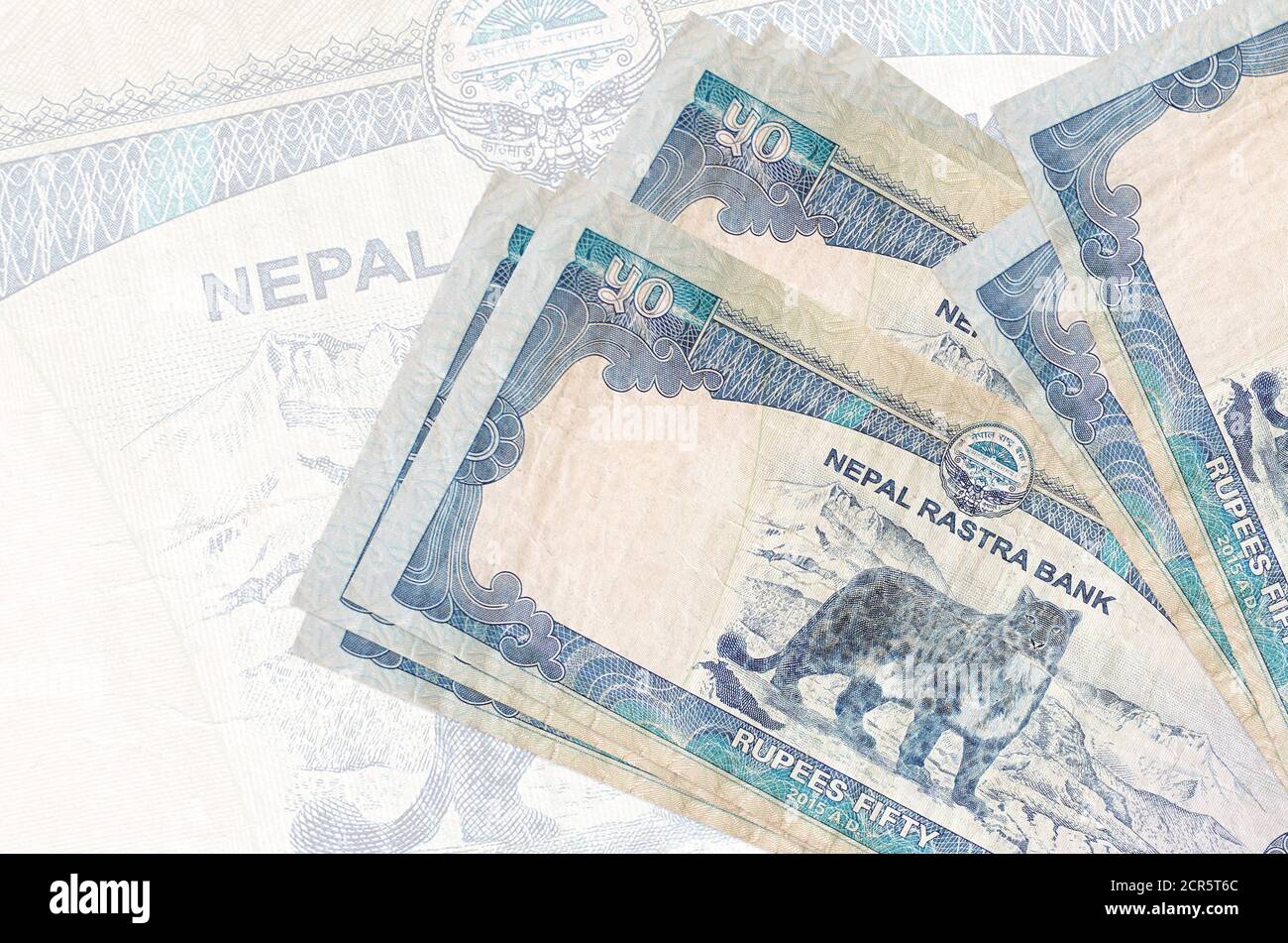 50 Nepalese rupees bills lies in stack on background of big semi ...