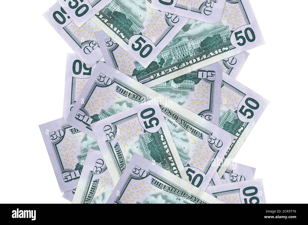 50 US dollars bills flying down isolated on white. Many banknotes ...