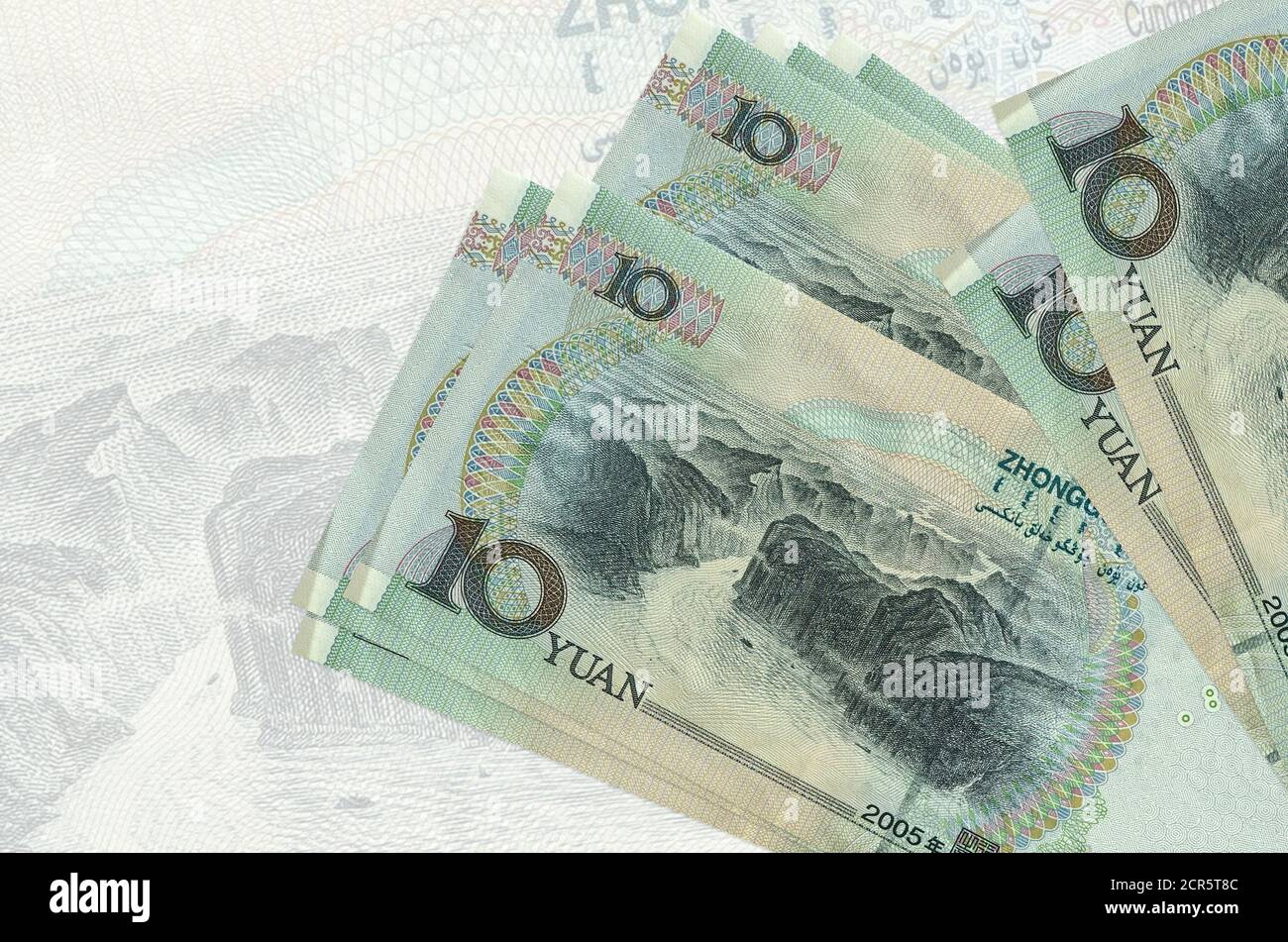 10 Chinese yuan bills lies in stack on background of big semi ...