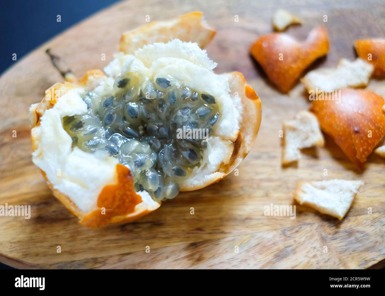 Sweet granadilla or Passiflora ligularis on wooden cutting boards on ...