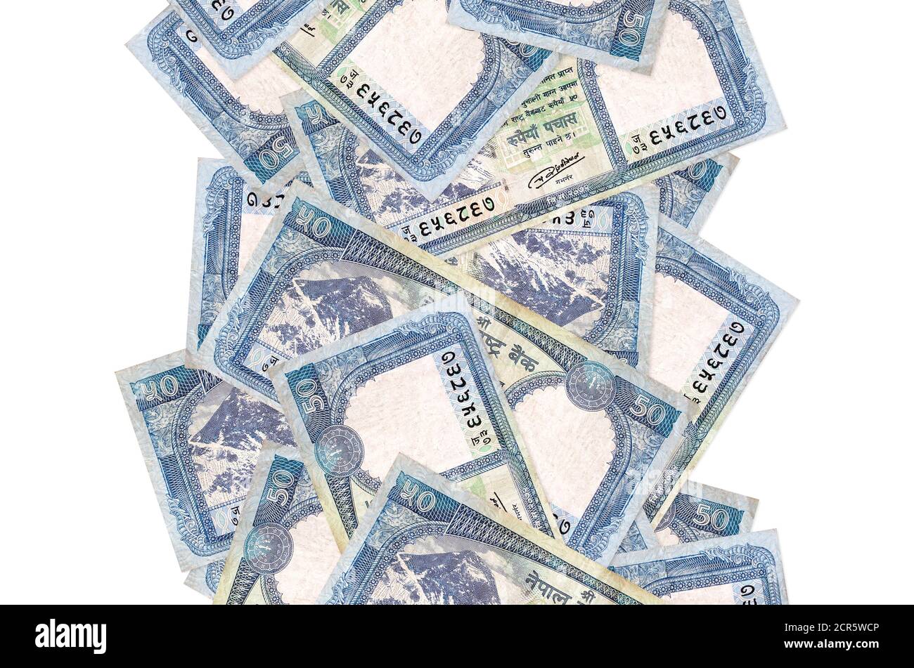50 Nepalese rupees bills flying down isolated on white. Many banknotes ...