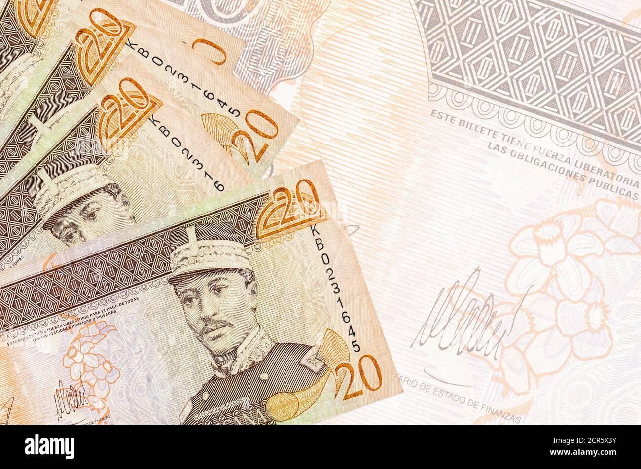 20 Dominican peso bills lies in stack on background of big semi ...