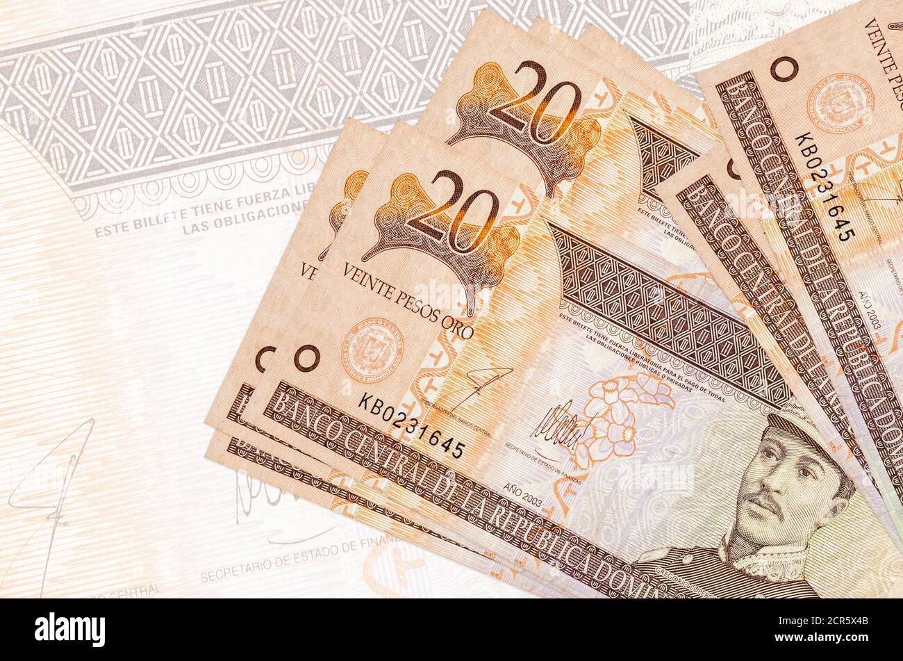 20 Dominican peso bills lies in stack on background of big semi ...