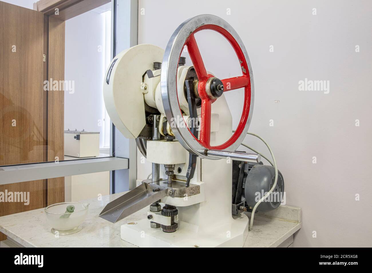 drug capsule and pill press machine in medicine manufacturing factory ...