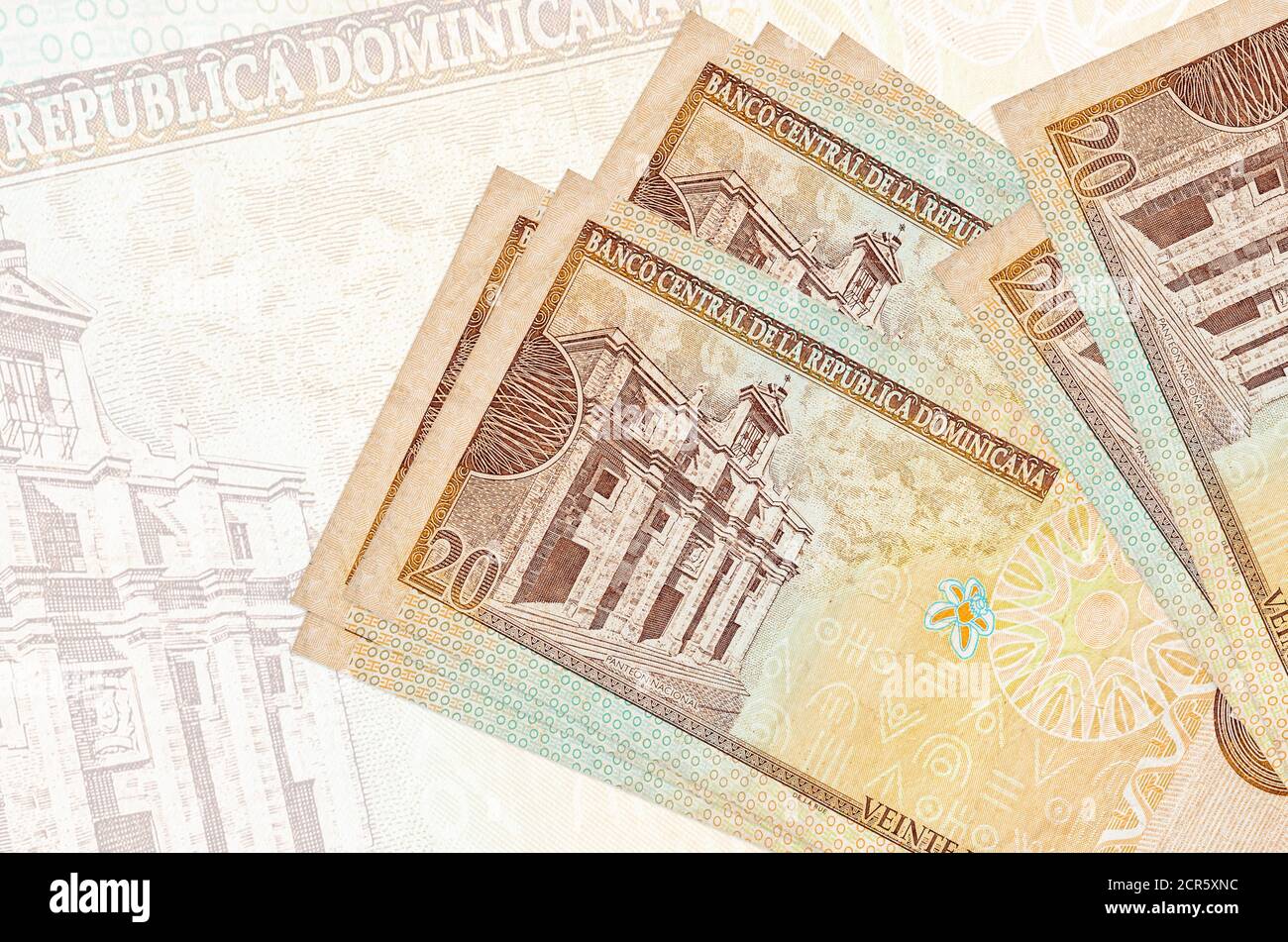 20 Dominican peso bills lies in stack on background of big semi ...