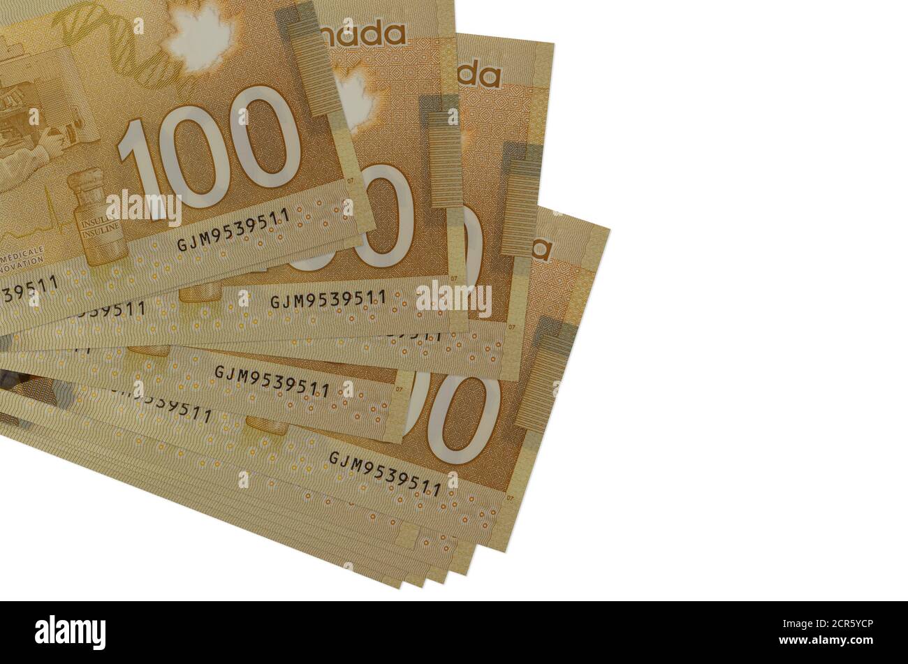 100 Canadian dollars bills lies in small bunch or pack isolated on ...
