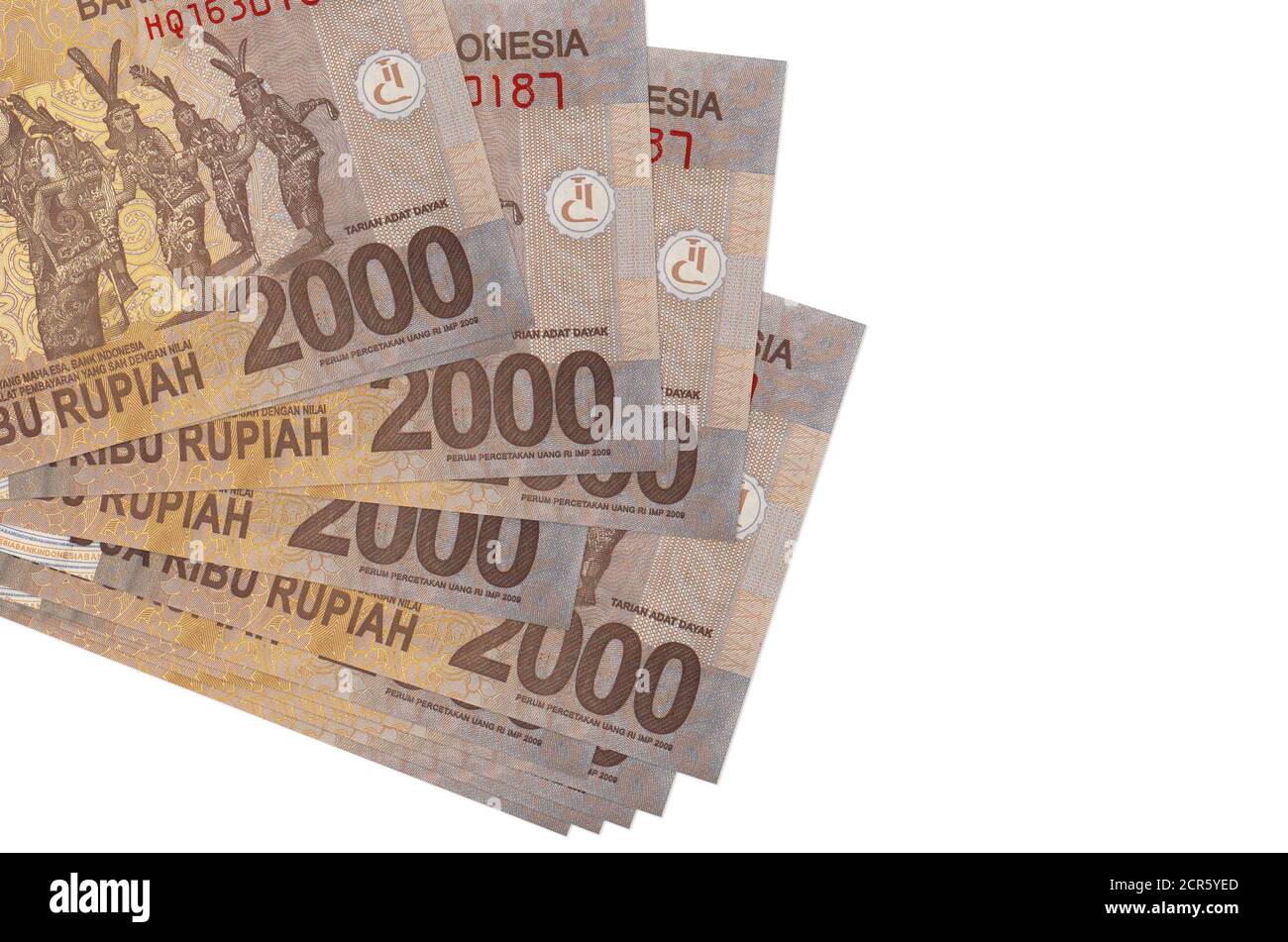 2000 Indonesian rupiah bills lies in small bunch or pack isolated on ...