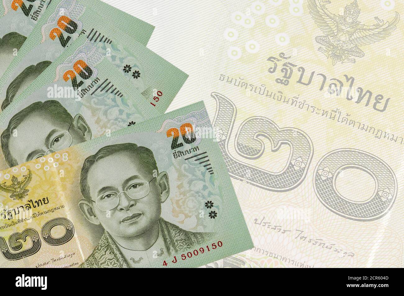 20 Thai Baht bills lies in stack on background of big semi-transparent ...