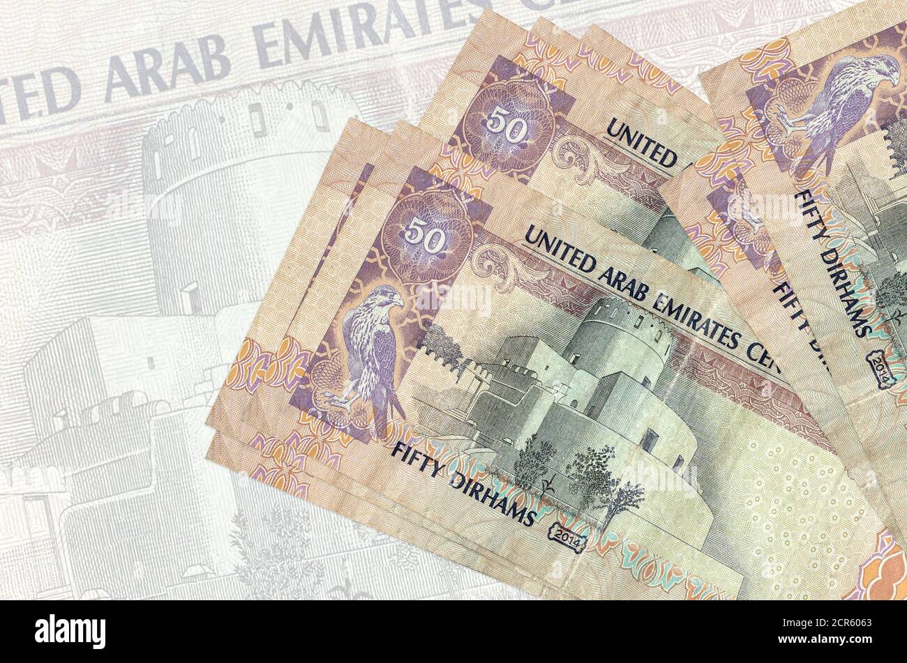 50 UAE dirhams bills lies in stack on background of big semi ...